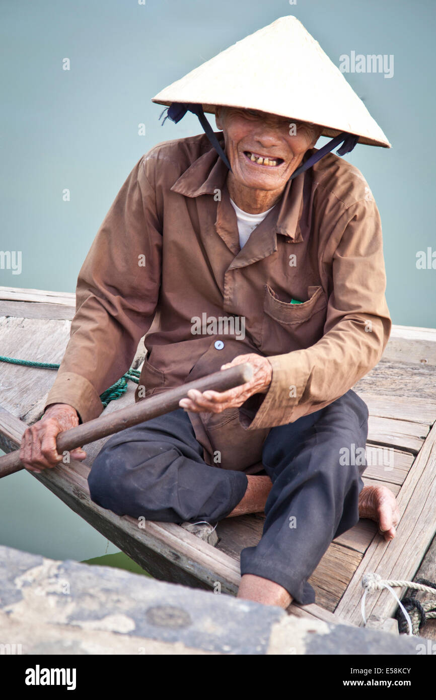 Old man in boat in Hoi An Stock Photo - Alamy
