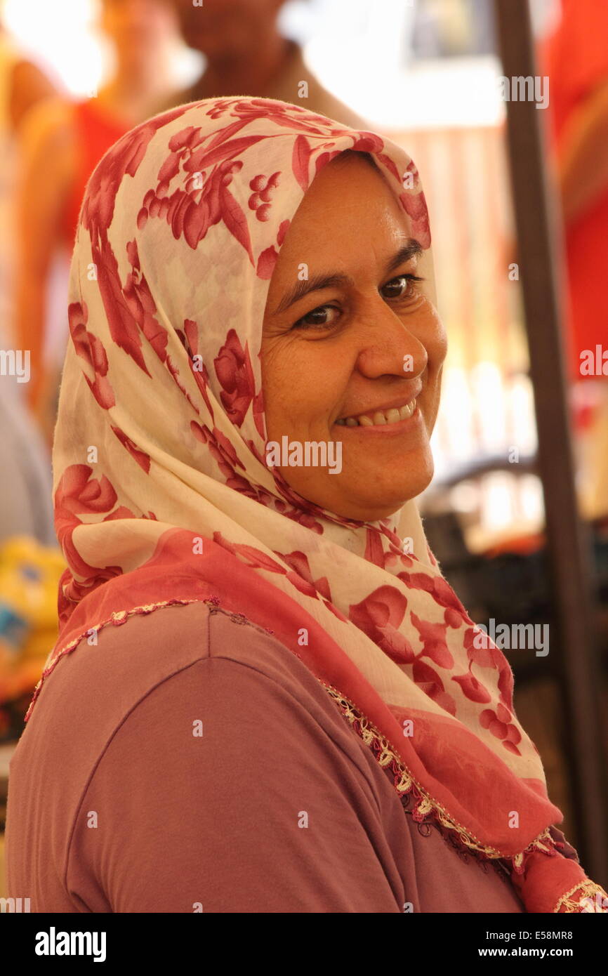 CALIS, TURKEY - 28TH MAY, 2013:A turkish lady sells her fresh fruits ...