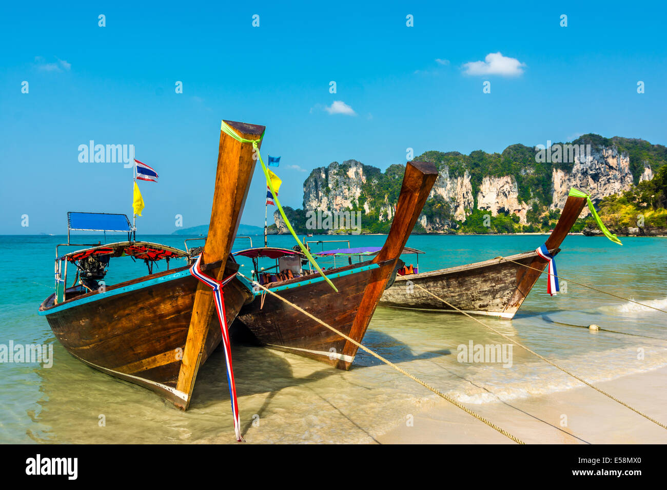 Longtail boats on Railey beach, Krabi, Thailand. Beautiful scenery with ...