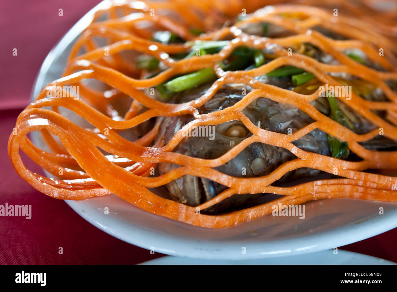 Fish in Carrot net, dinner at boat in Halong Bay Stock Photo - Alamy