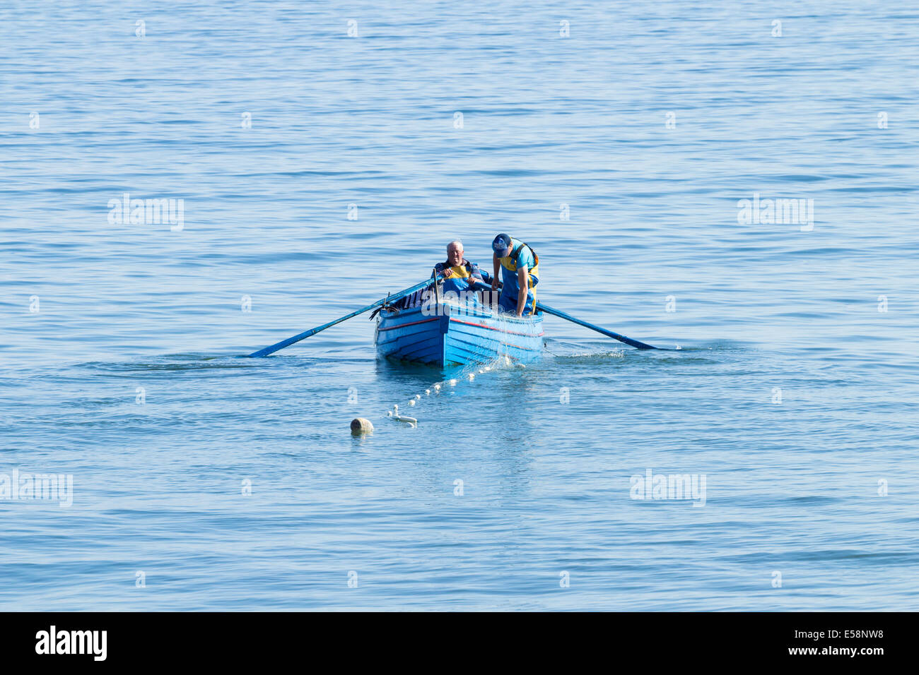 Fishermen checking their fishing nets hi-res stock photography and images - Alamy