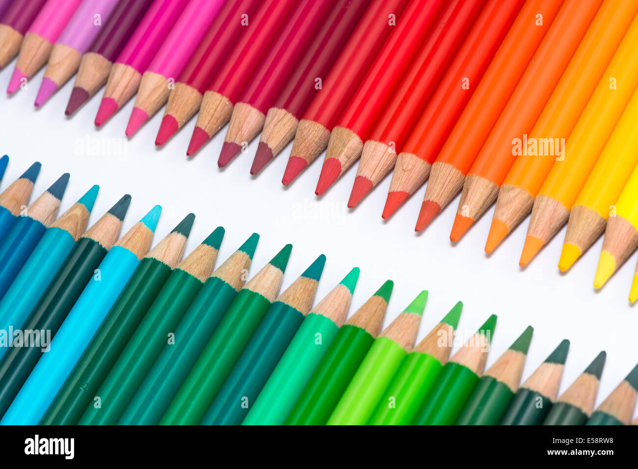Two Isolated Opposite Rows Of Colorful Crayons Stock Photo - Alamy