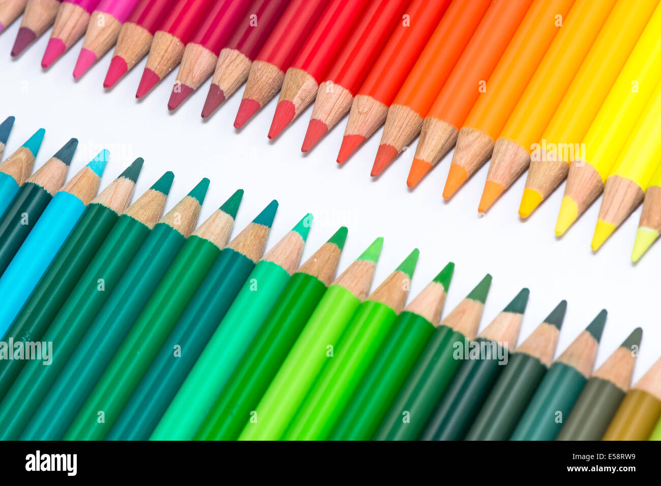 Two Isolated Opposite Rows Of Colorful Crayons Stock Photo - Alamy