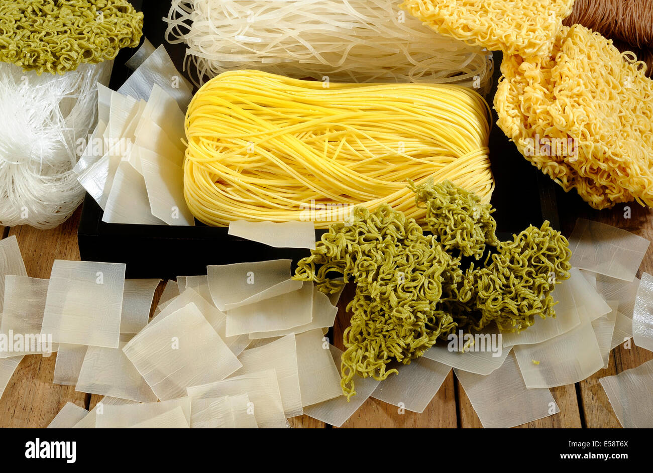 variety types and shapes of noodles on wooden background Stock Photo ...