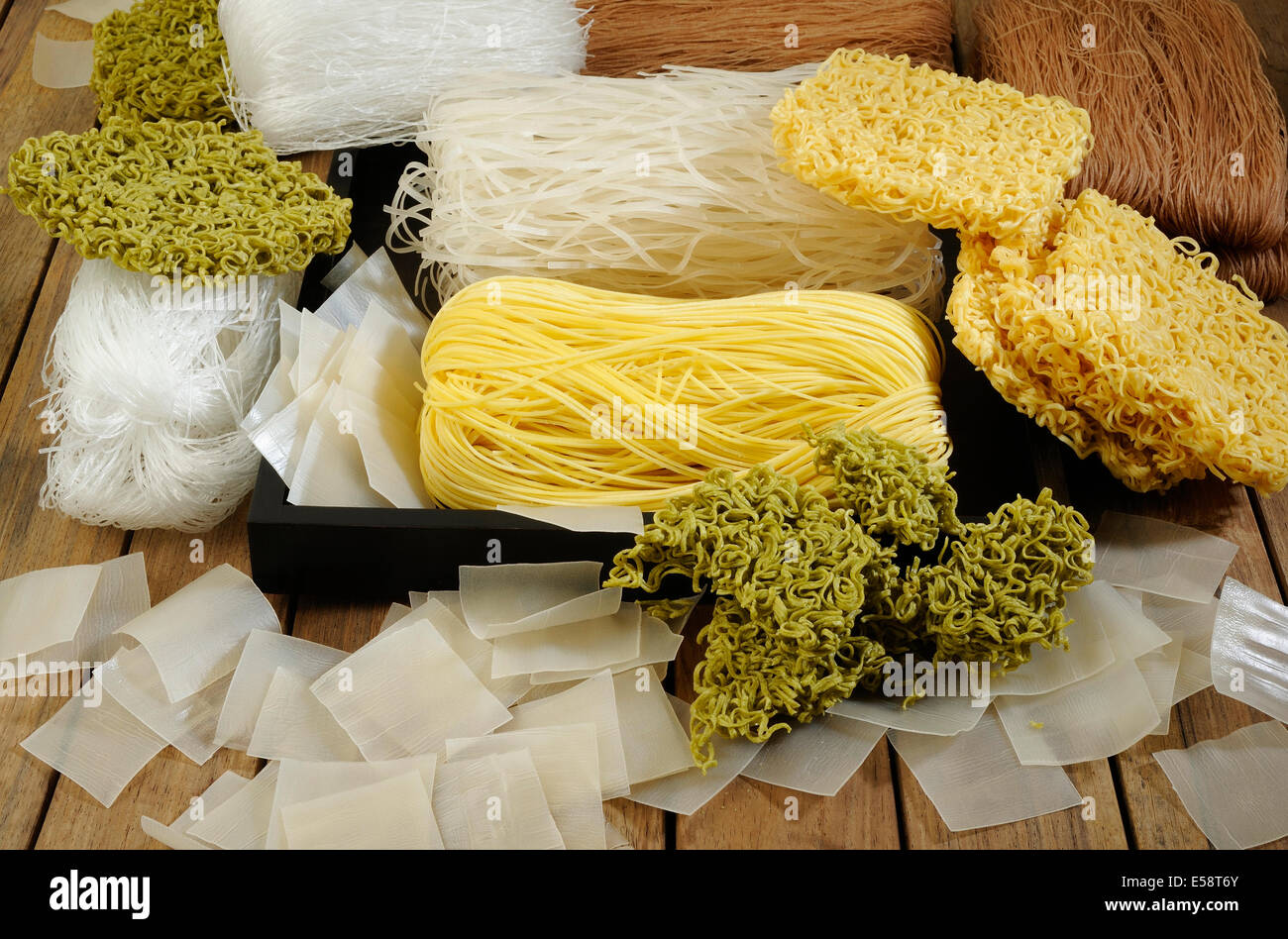 variety types and shapes of noodles on wooden background Stock Photo ...