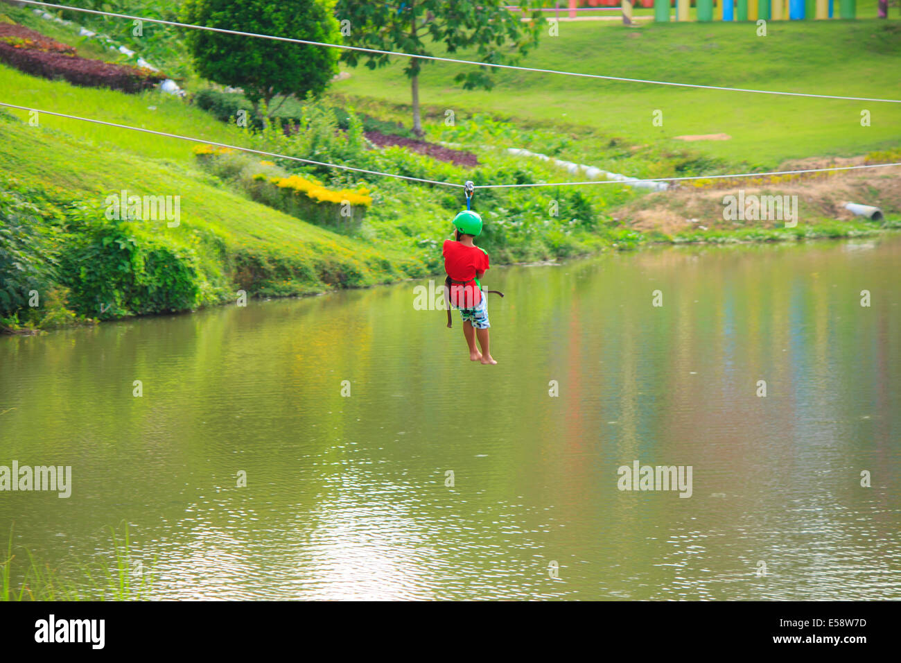 young boy sliding in adventure park Stock Photo Stock Photo - Alamy