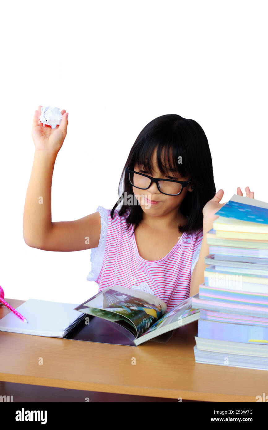 Stock Photo - Portrait of cheerful Asian young girl doing her homework ...