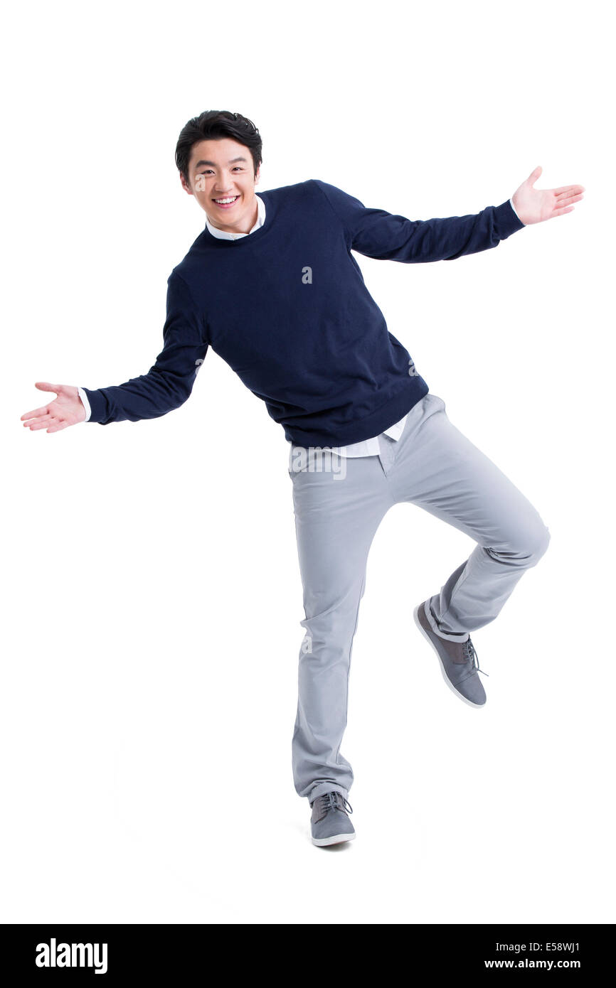 Cheerful young man arms outstretched Stock Photo - Alamy