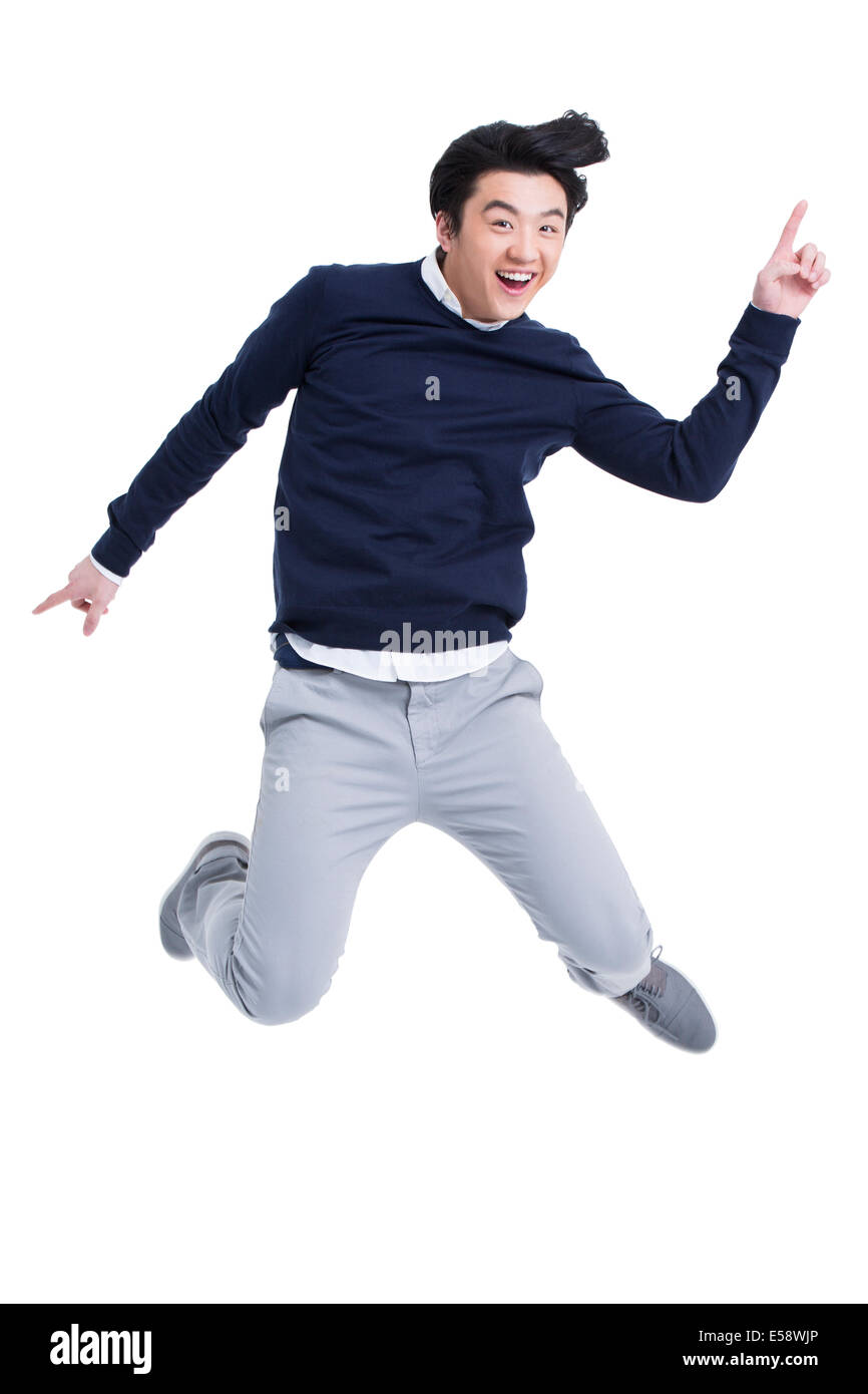 Young man jumping Stock Photo - Alamy