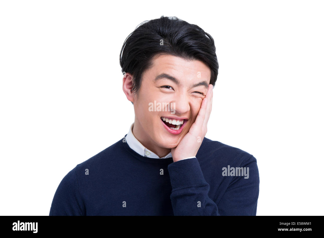 Cheerful young man laughing Stock Photo - Alamy
