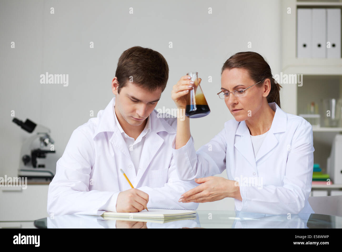 Biomedical analysis scientist making hi-res stock photography and ...