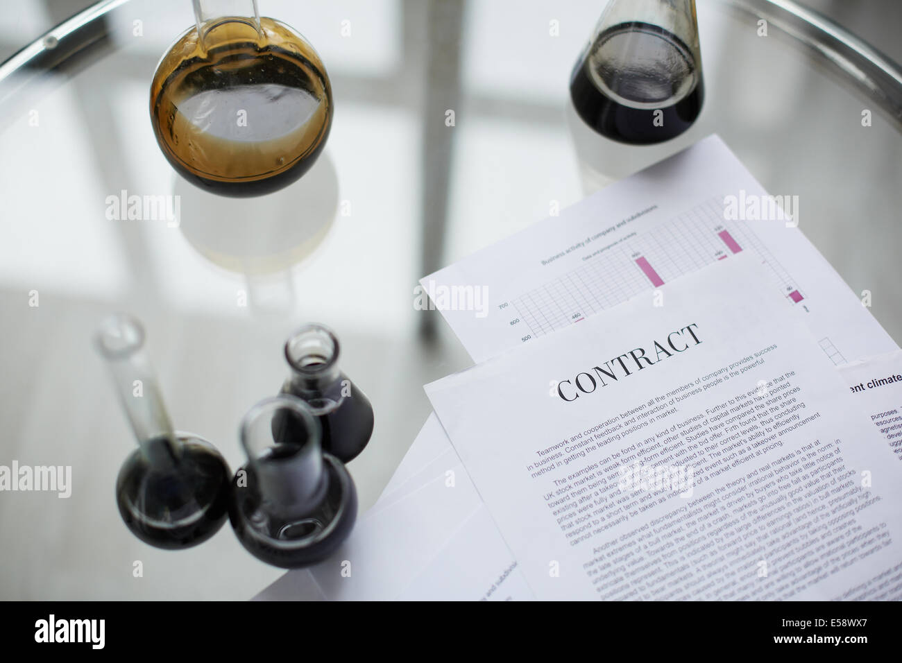 Test-tubes with liquid oil over contract in laboratory Stock Photo - Alamy