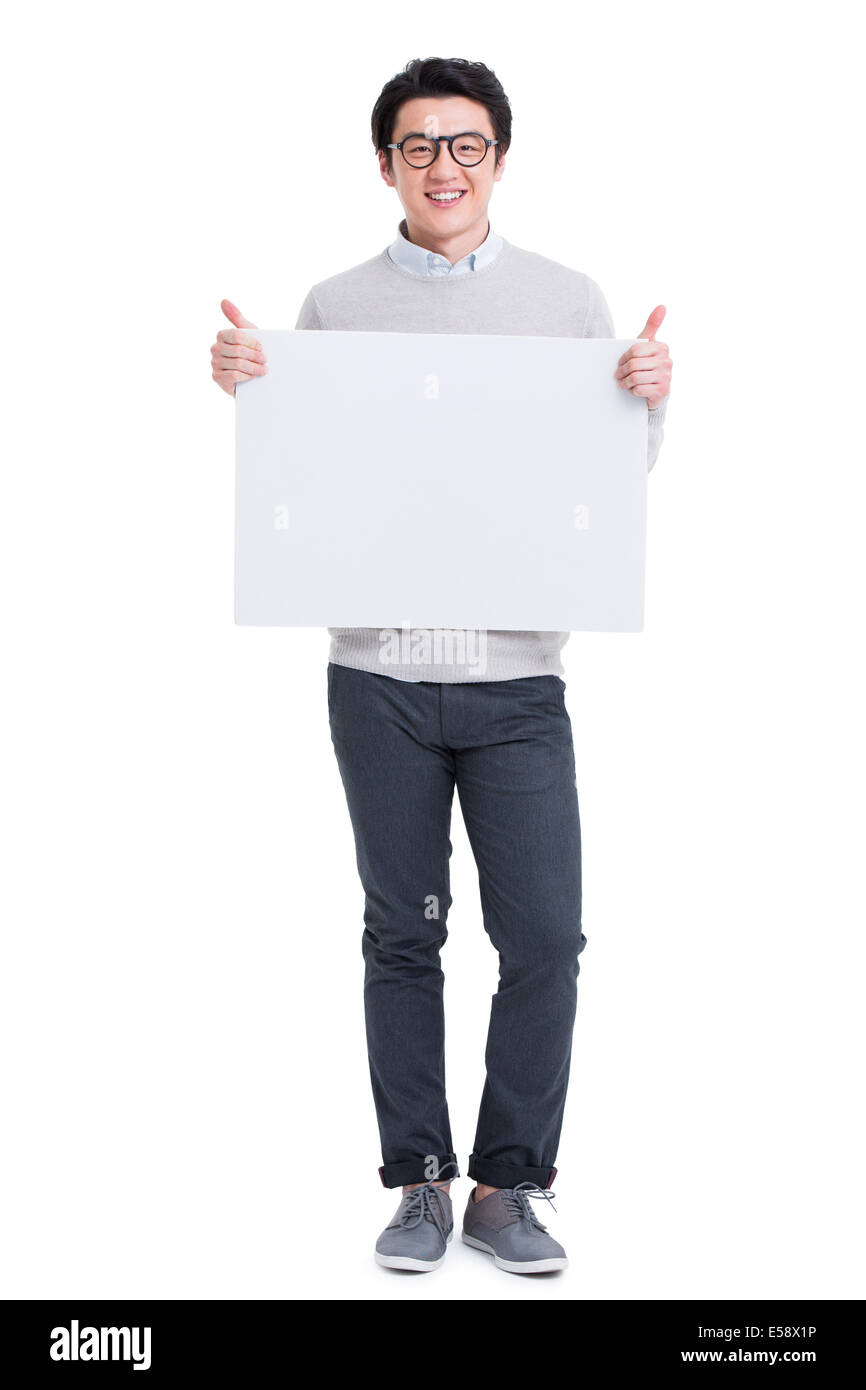 Cheerful young man holding whiteboard Stock Photo - Alamy