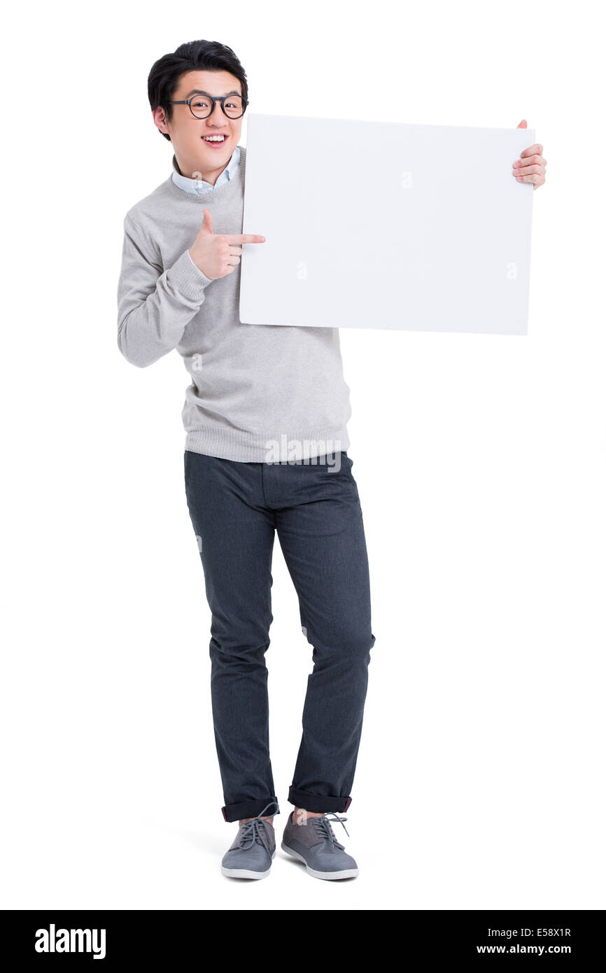 Cheerful young man holding whiteboard Stock Photo - Alamy