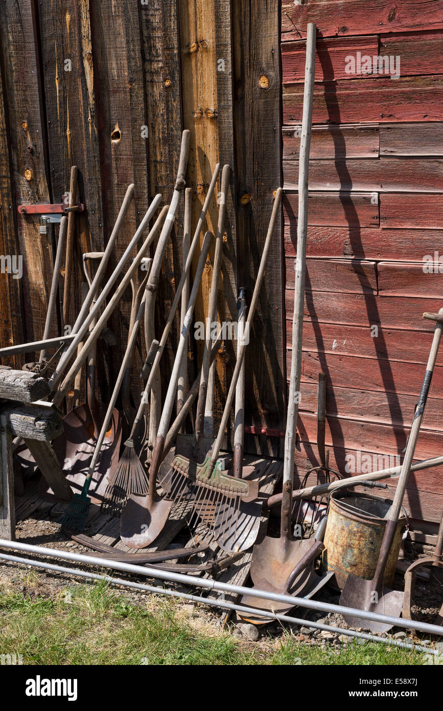 Hand tools leaning against a barn in Oregon's Wallowa Valley Stock ...