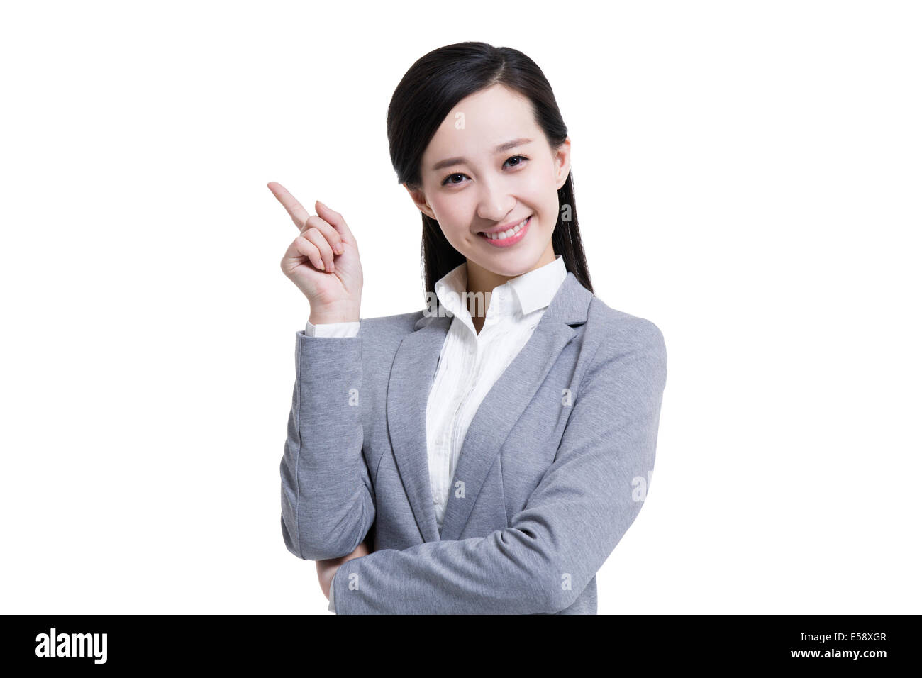 Happy businesswoman raising her finger Stock Photo - Alamy