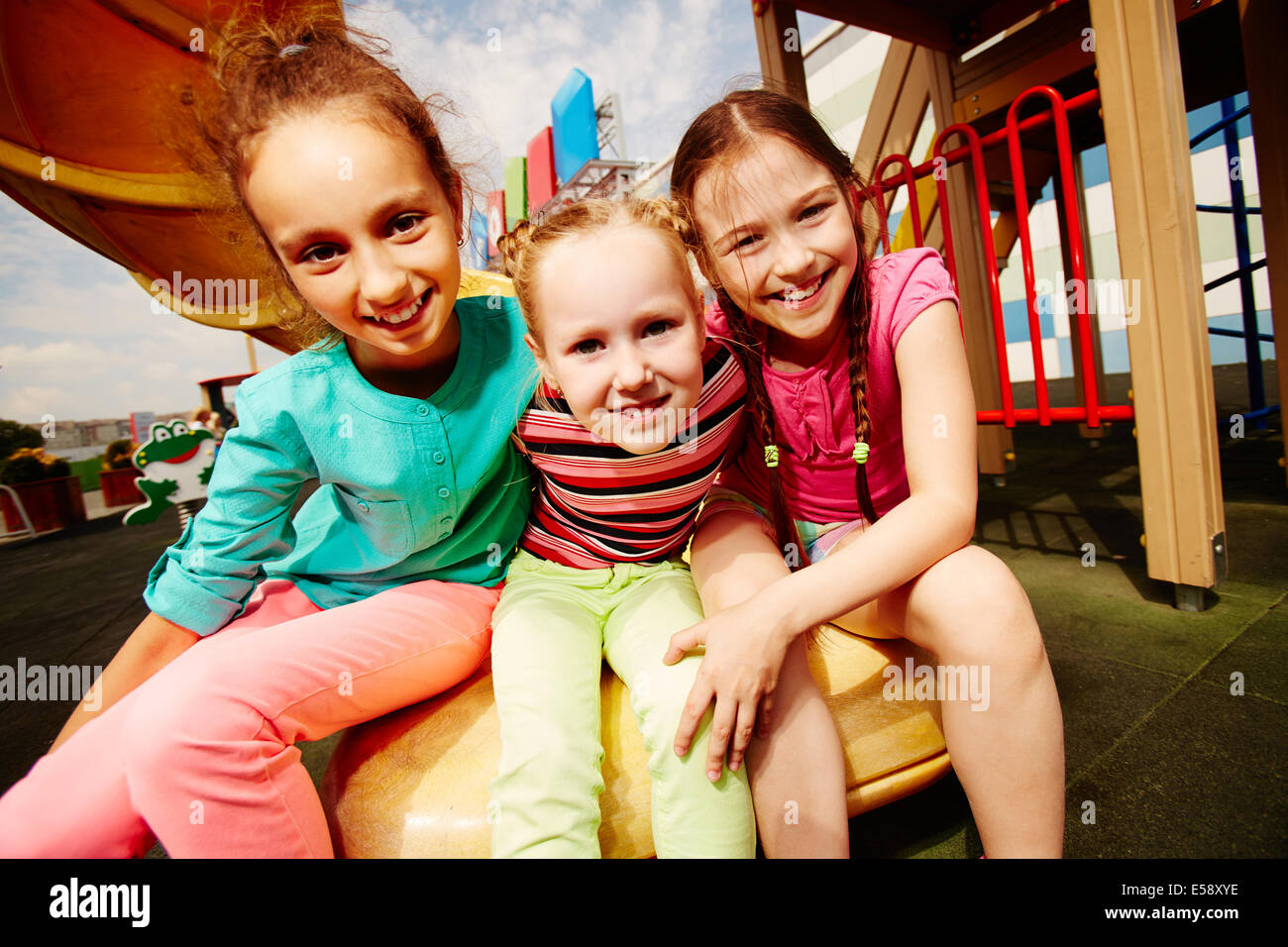 Image of cute girls spending time on playground outdoors Stock Photo ...