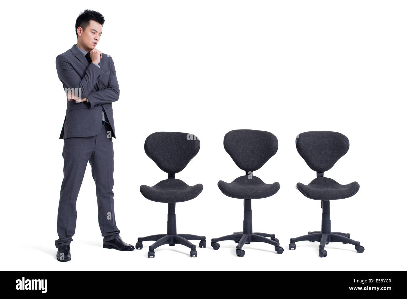 Young man selecting suitable position Stock Photo - Alamy