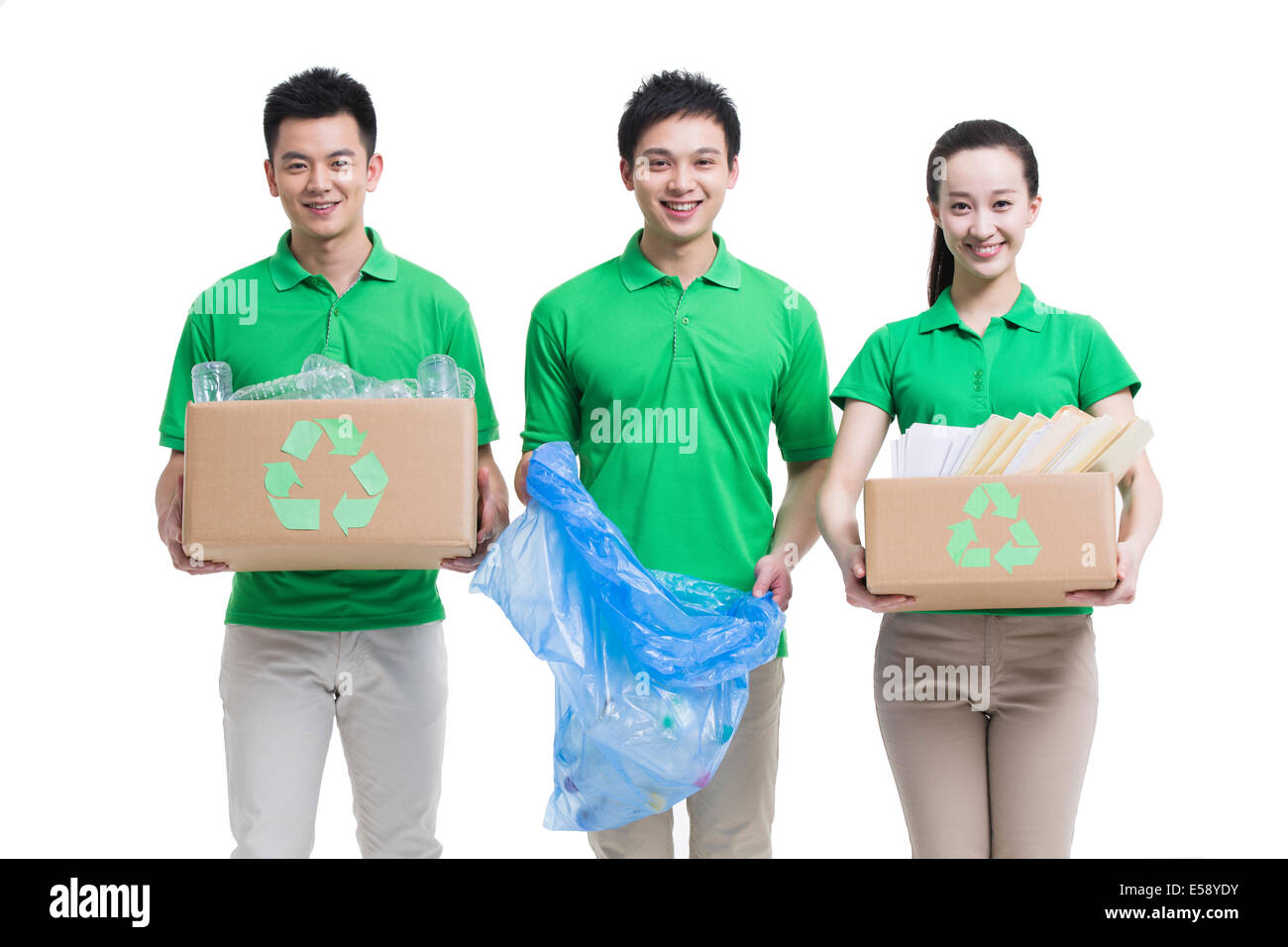 Happy volunteers recycling Stock Photo - Alamy