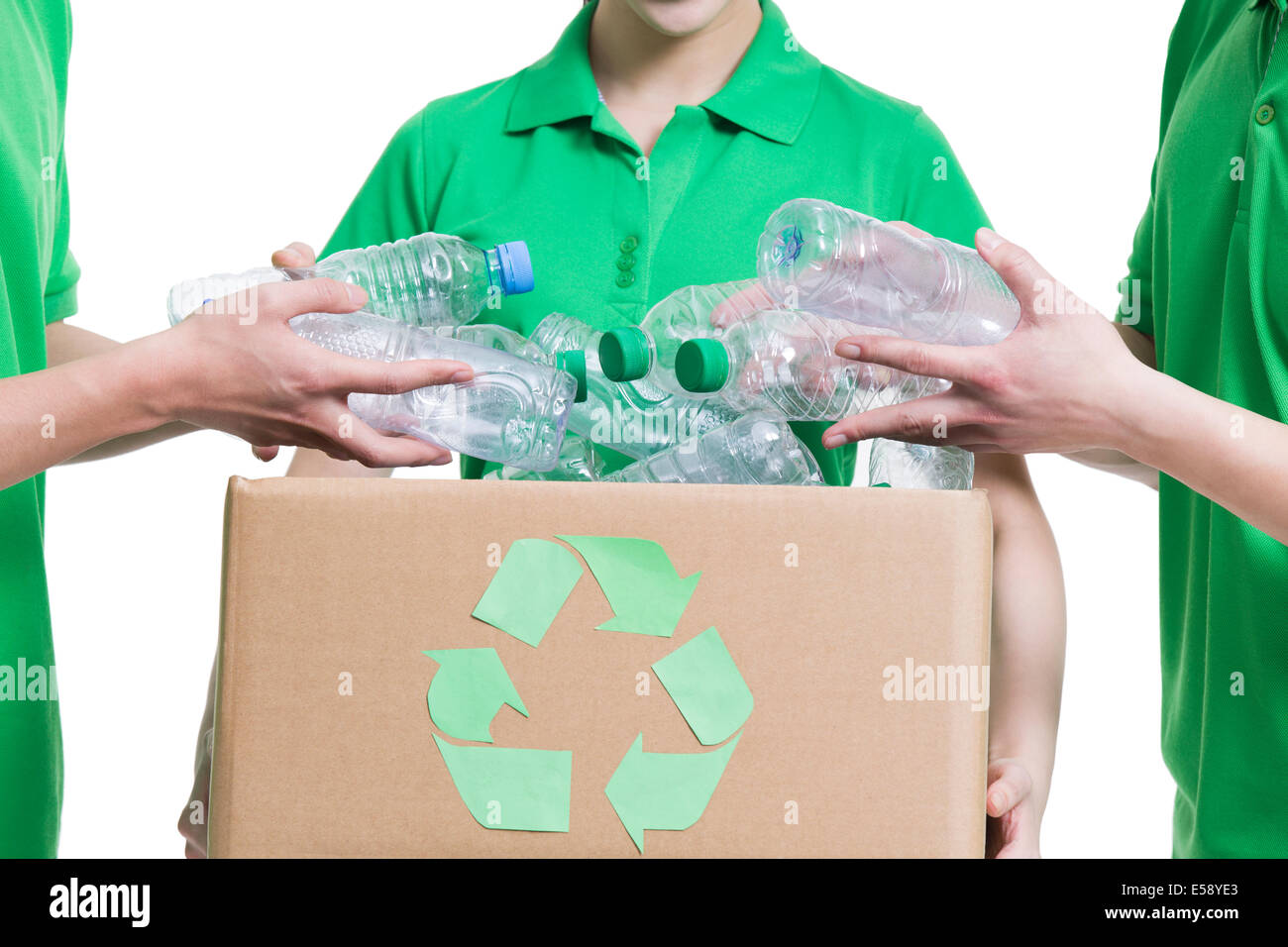 Happy volunteers recycling Stock Photo - Alamy