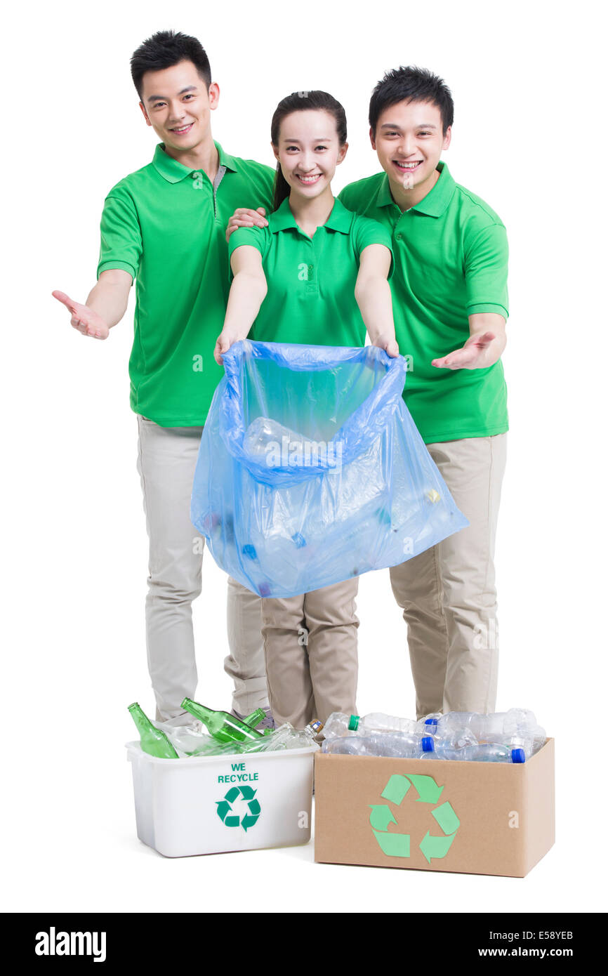 Happy volunteers recycling Stock Photo - Alamy