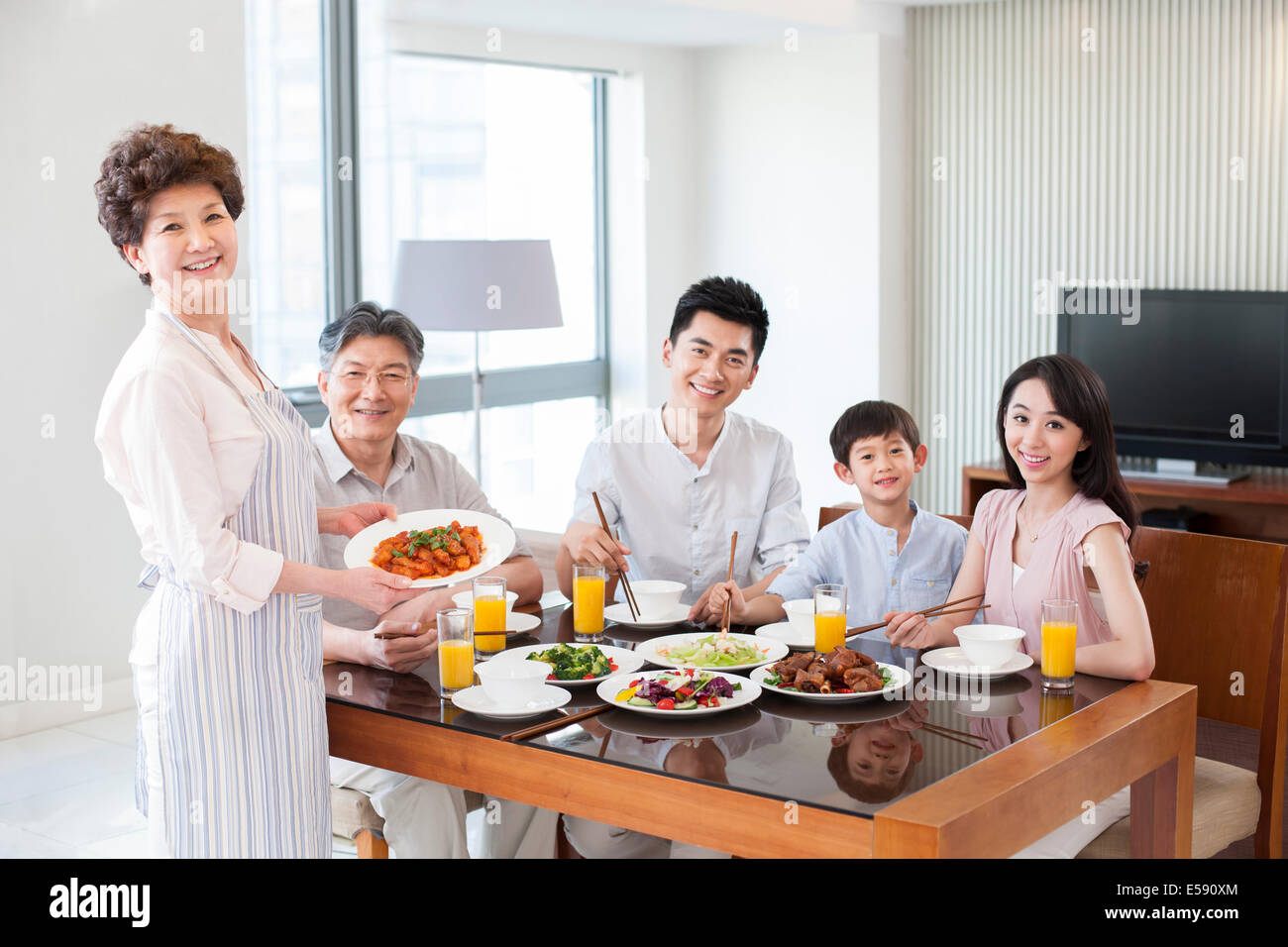 Happy family having lunch Stock Photo - Alamy