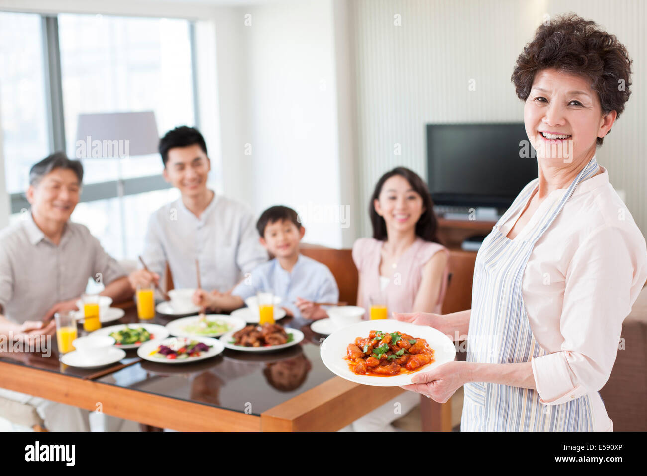 Happy family having lunch Stock Photo - Alamy