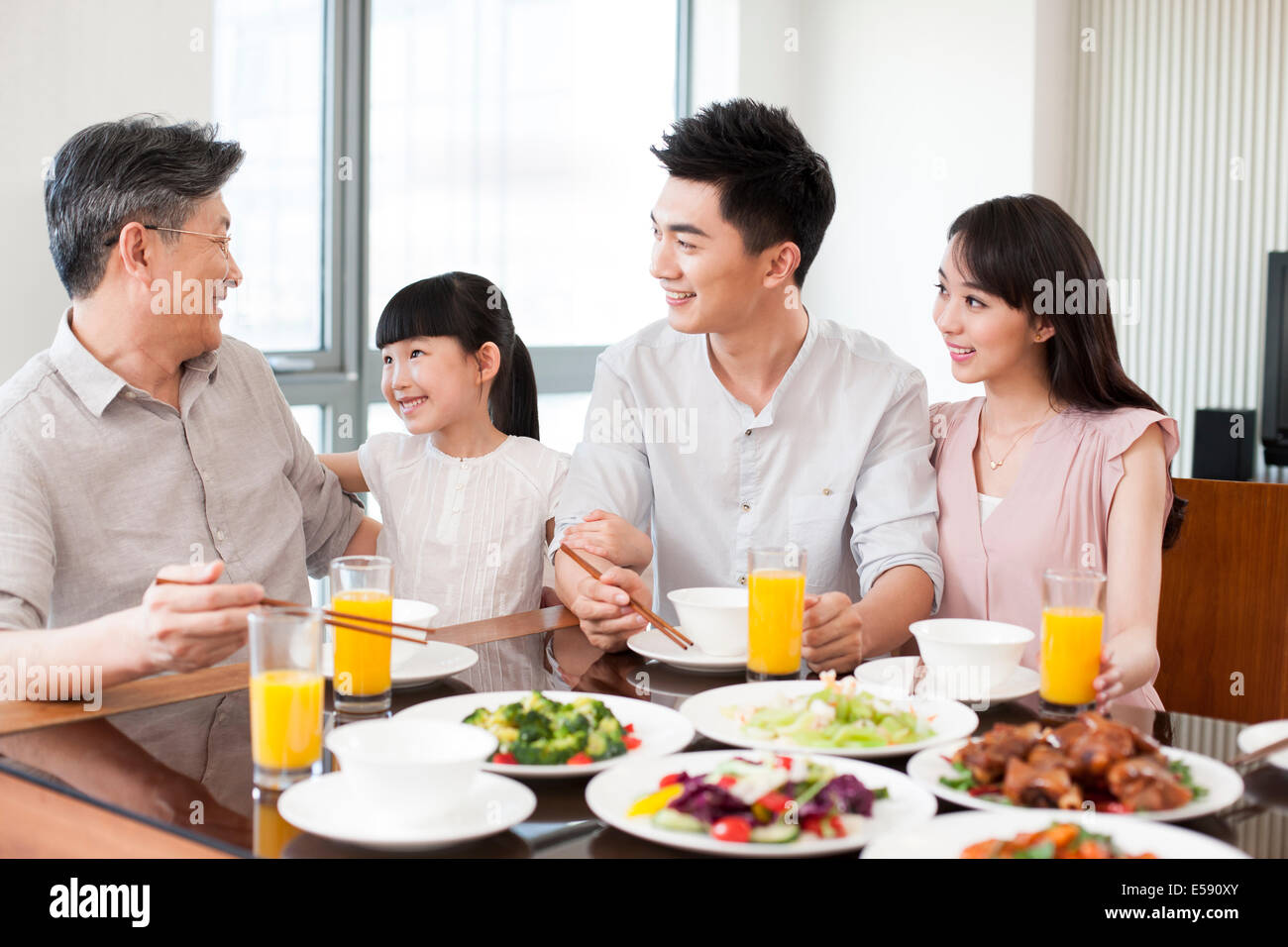 Happy family having lunch Stock Photo - Alamy