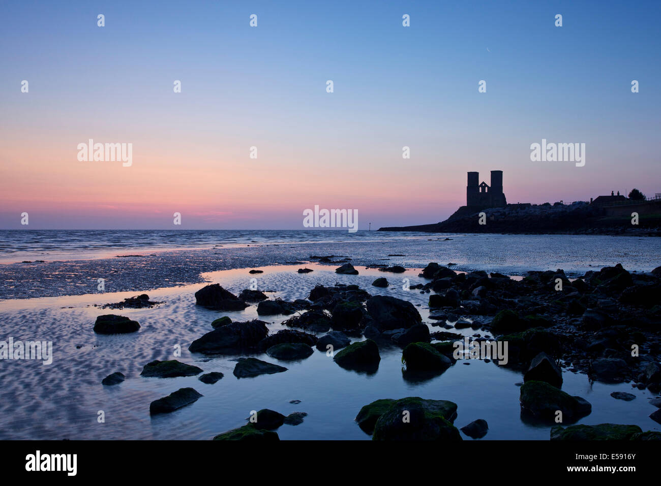 Reculver, Kent, UK 24th July, 2014. Pre-dawn sunrise at low tide near ...