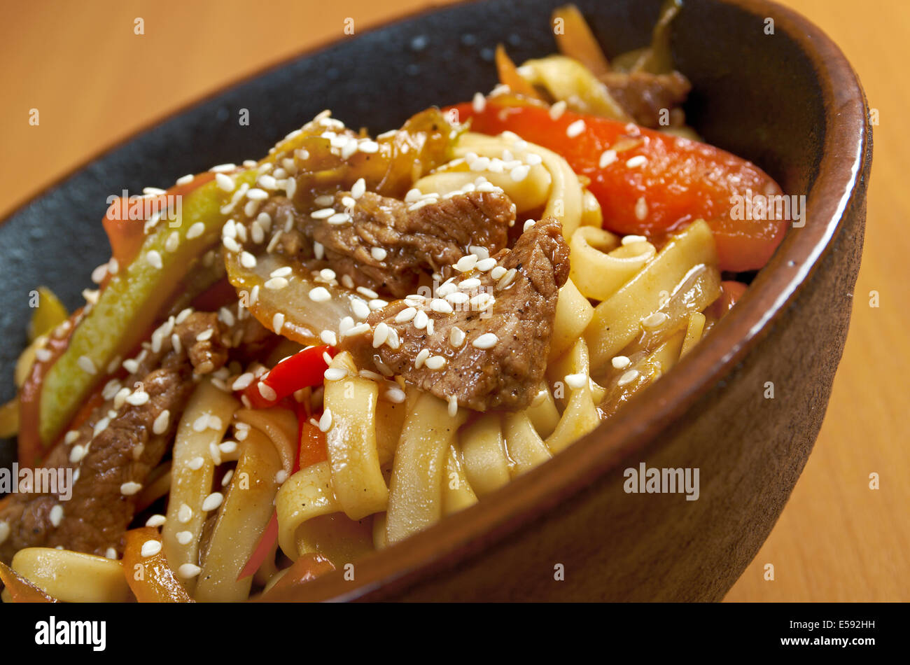 Cooking udon teppanyaki with pork , japanese cuisine Stock Photo - Alamy