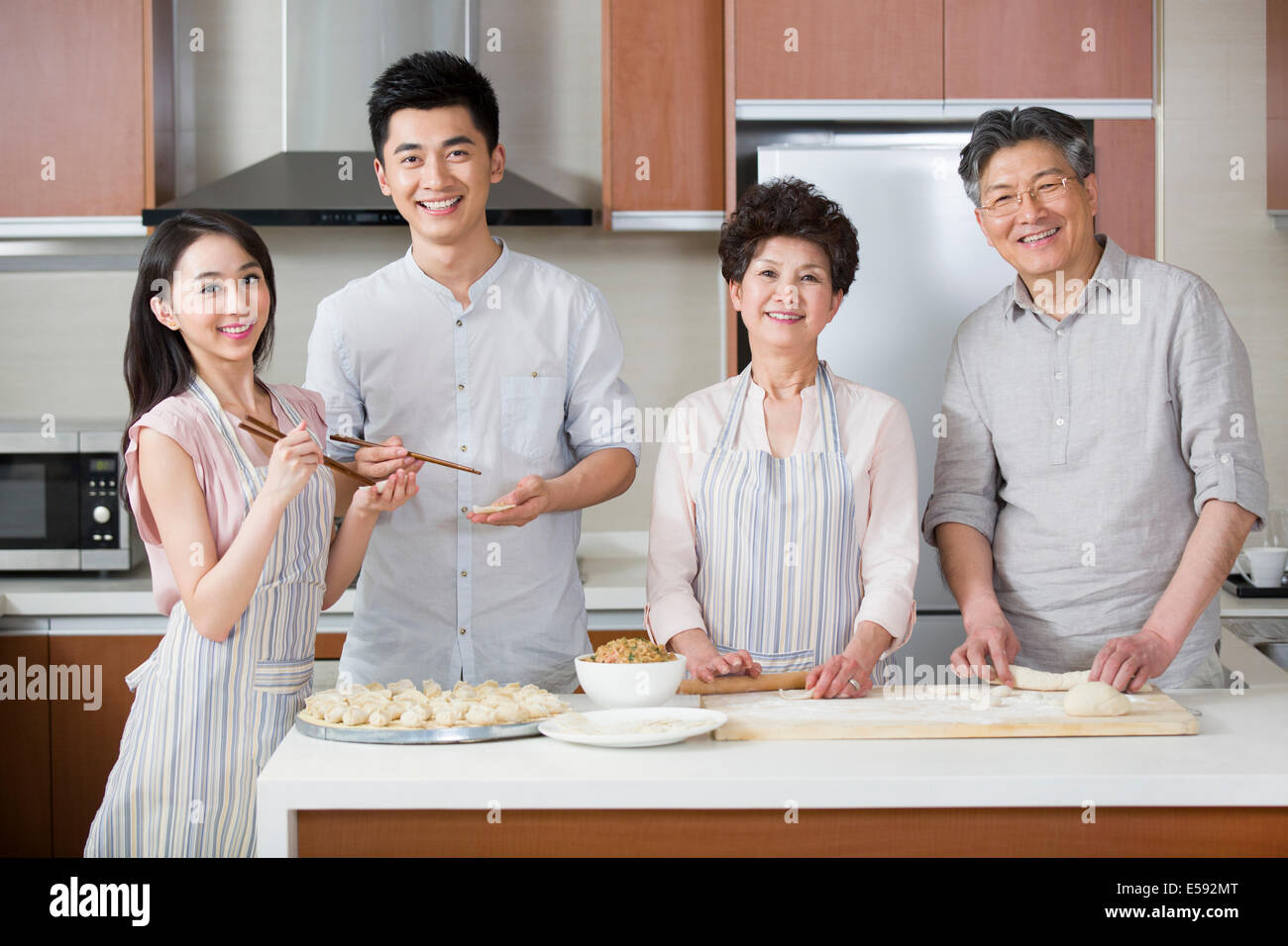 Happy family making dumplings Stock Photo - Alamy Happy family making dumplings Stock Photo - Alamy