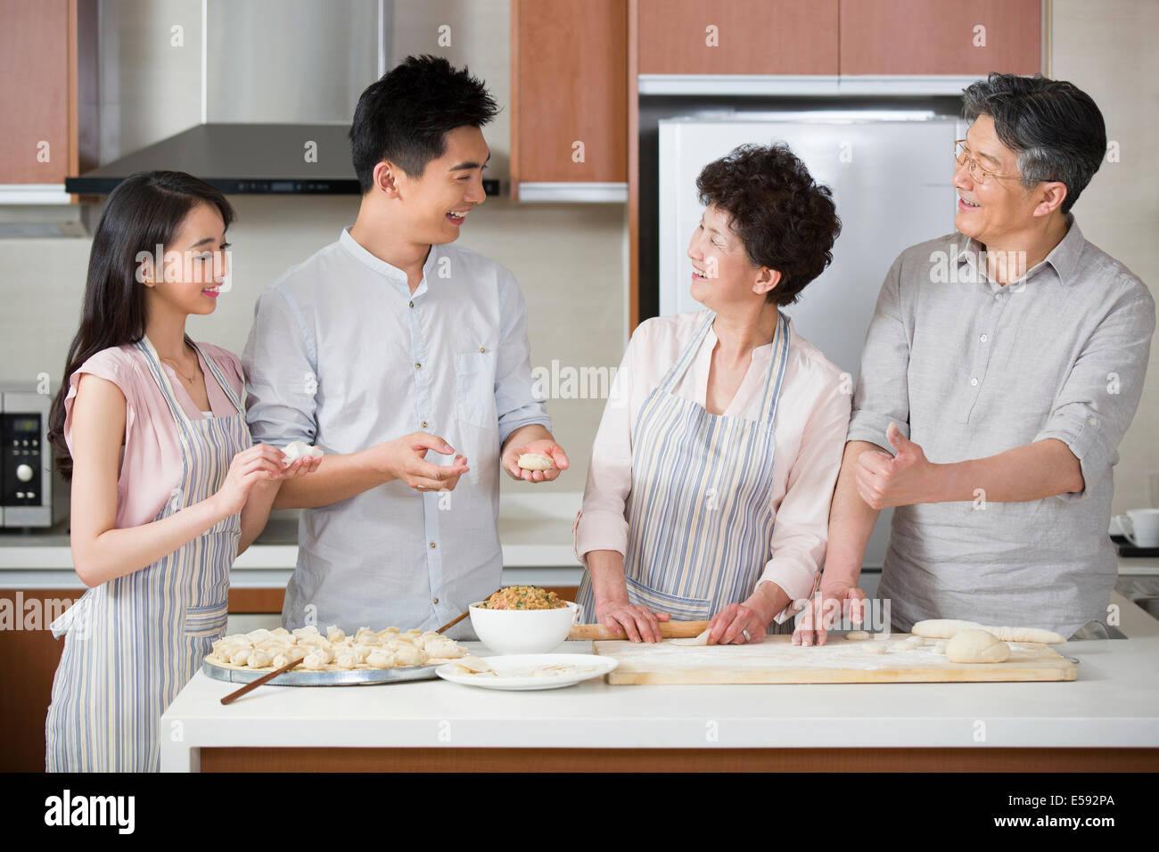 Happy family making dumplings Stock Photo - Alamy Happy family making dumplings Stock Photo - Alamy
