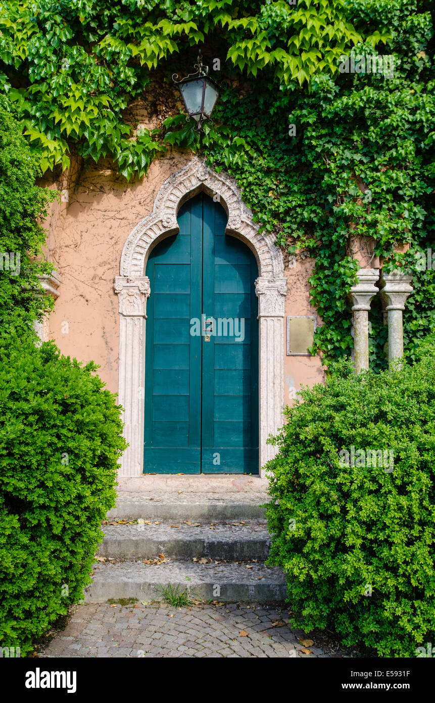 old mysterious door in the garden Stock Photo - Alamy