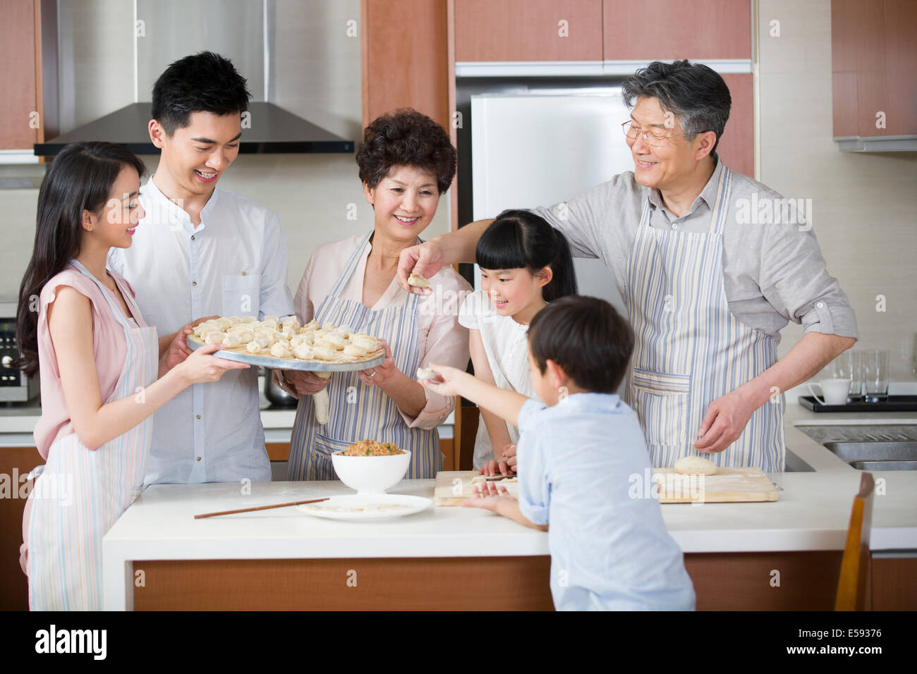 Happy family making dumplings Stock Photo - Alamy Happy family making dumplings Stock Photo - Alamy