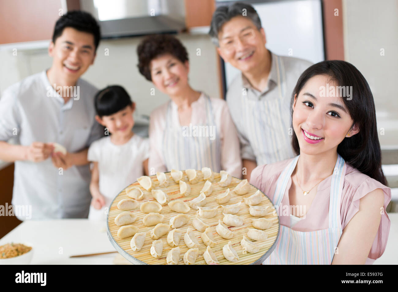 Happy family making dumplings Stock Photo - Alamy Happy family making dumplings Stock Photo - Alamy