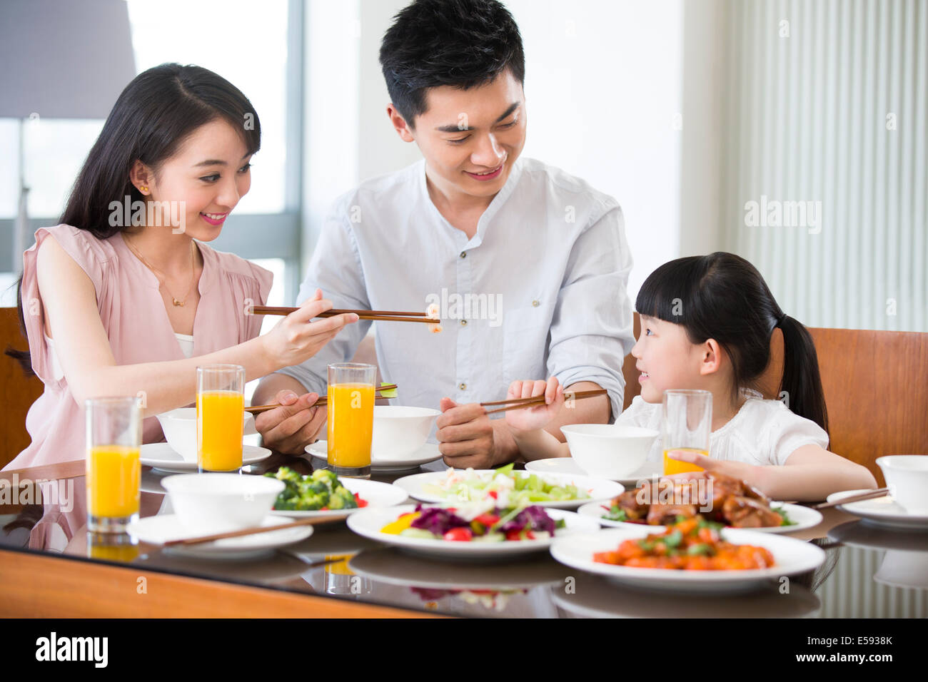 Happy family having lunch Stock Photo - Alamy