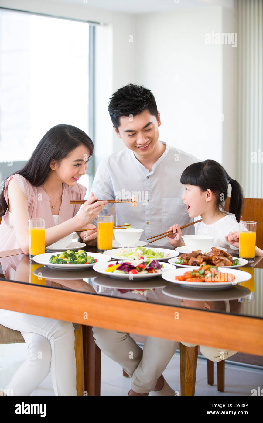 Happy family having lunch Stock Photo - Alamy