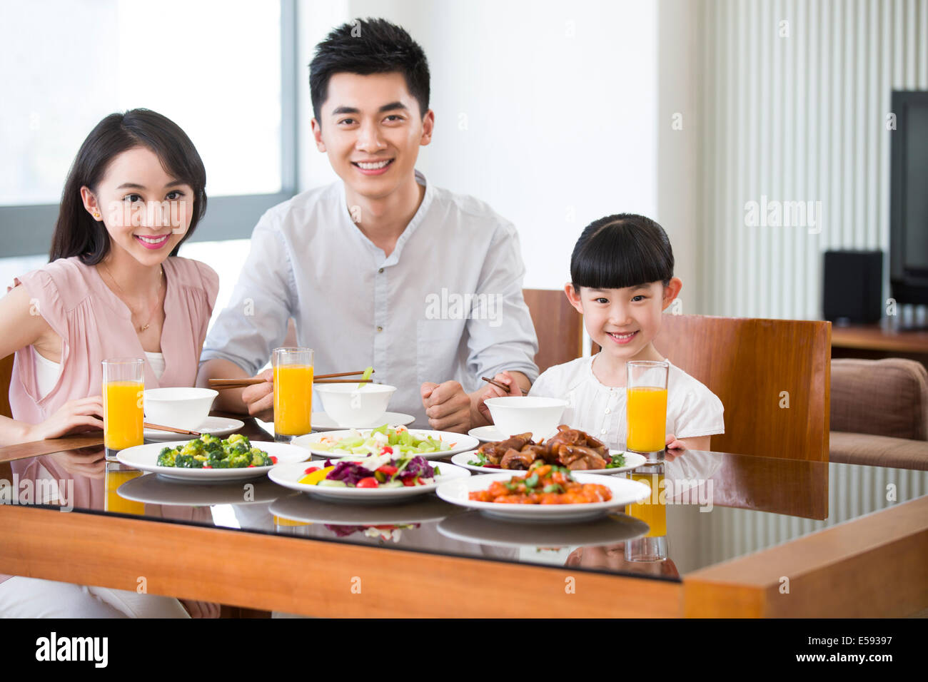 Happy family having lunch Stock Photo - Alamy