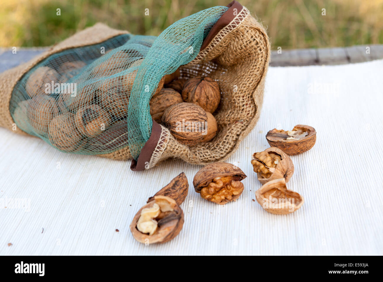 Open walnuts in sack Stock Photo - Alamy