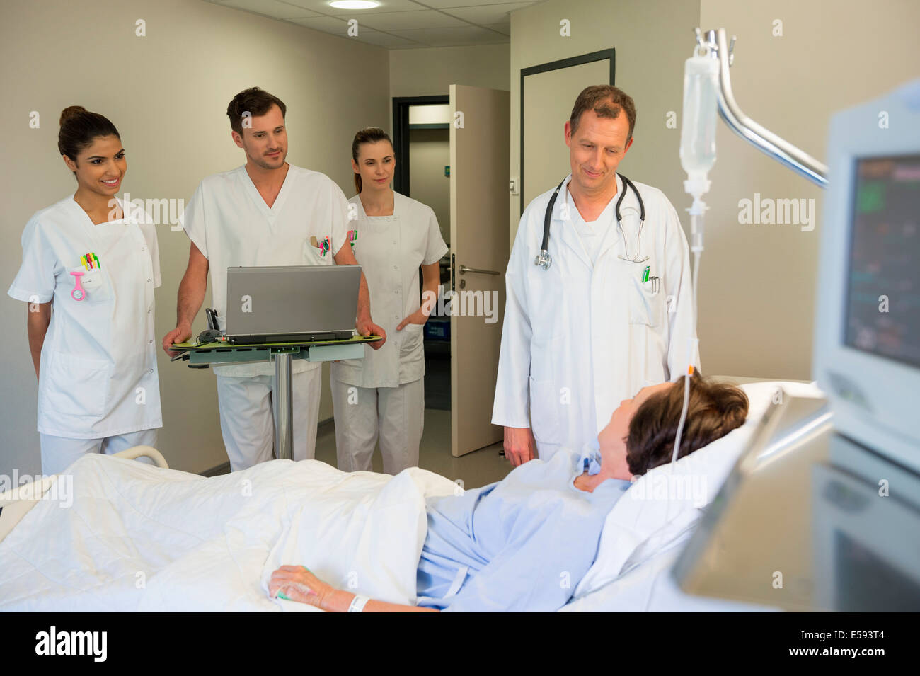 Patient attending to senior hospital hi-res stock photography and ...