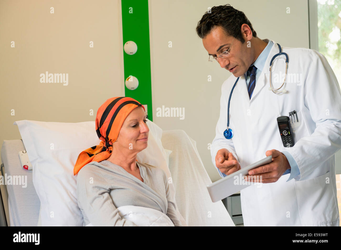 Doctor showing medical report to a patient Stock Photo - Alamy