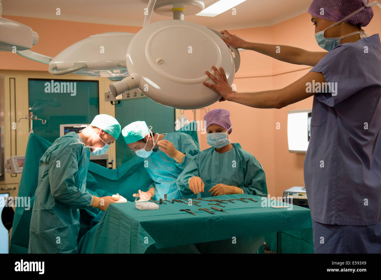 Medical team operating a patient in an operating room Stock Photo - Alamy