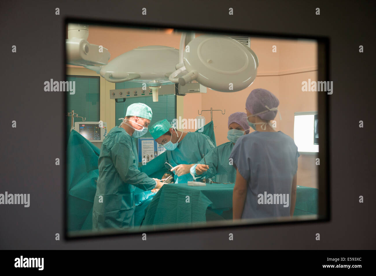 Medical team operating a patient in an operating room Stock Photo - Alamy