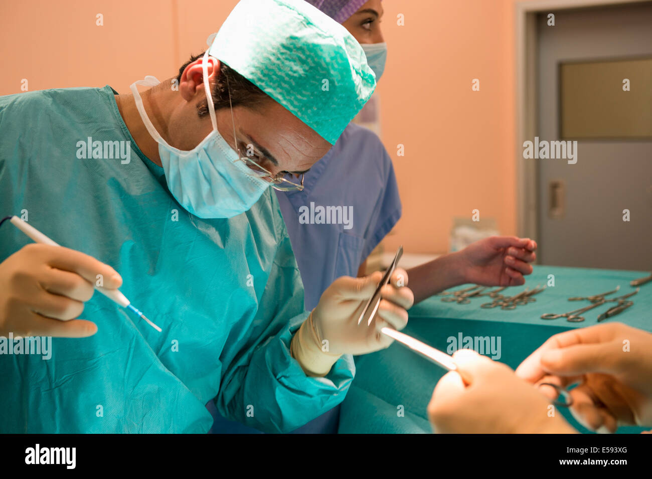 Medical team operating a patient in an operating room Stock Photo - Alamy