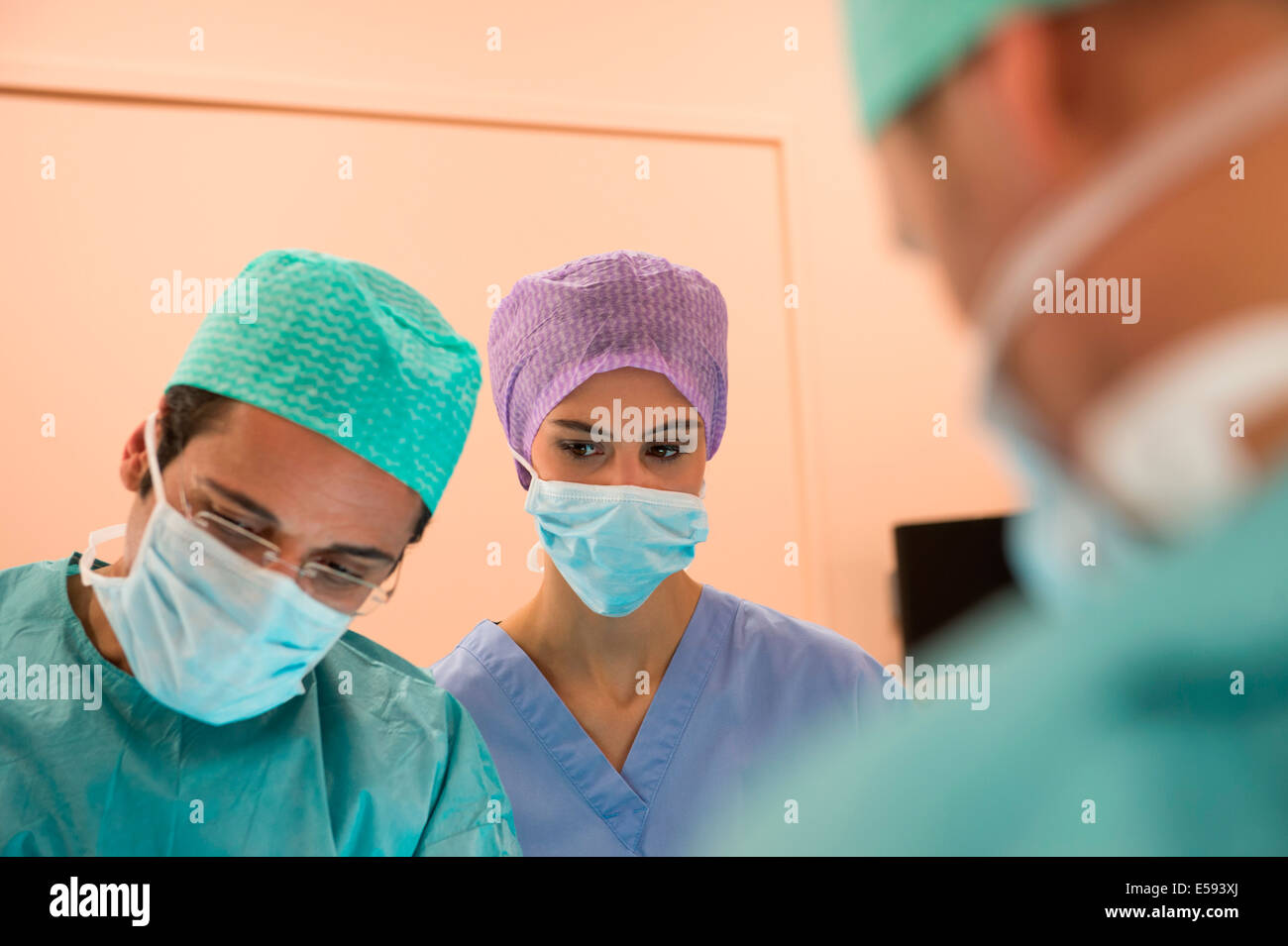 Medical team performing an operation in an operating room Stock Photo ...