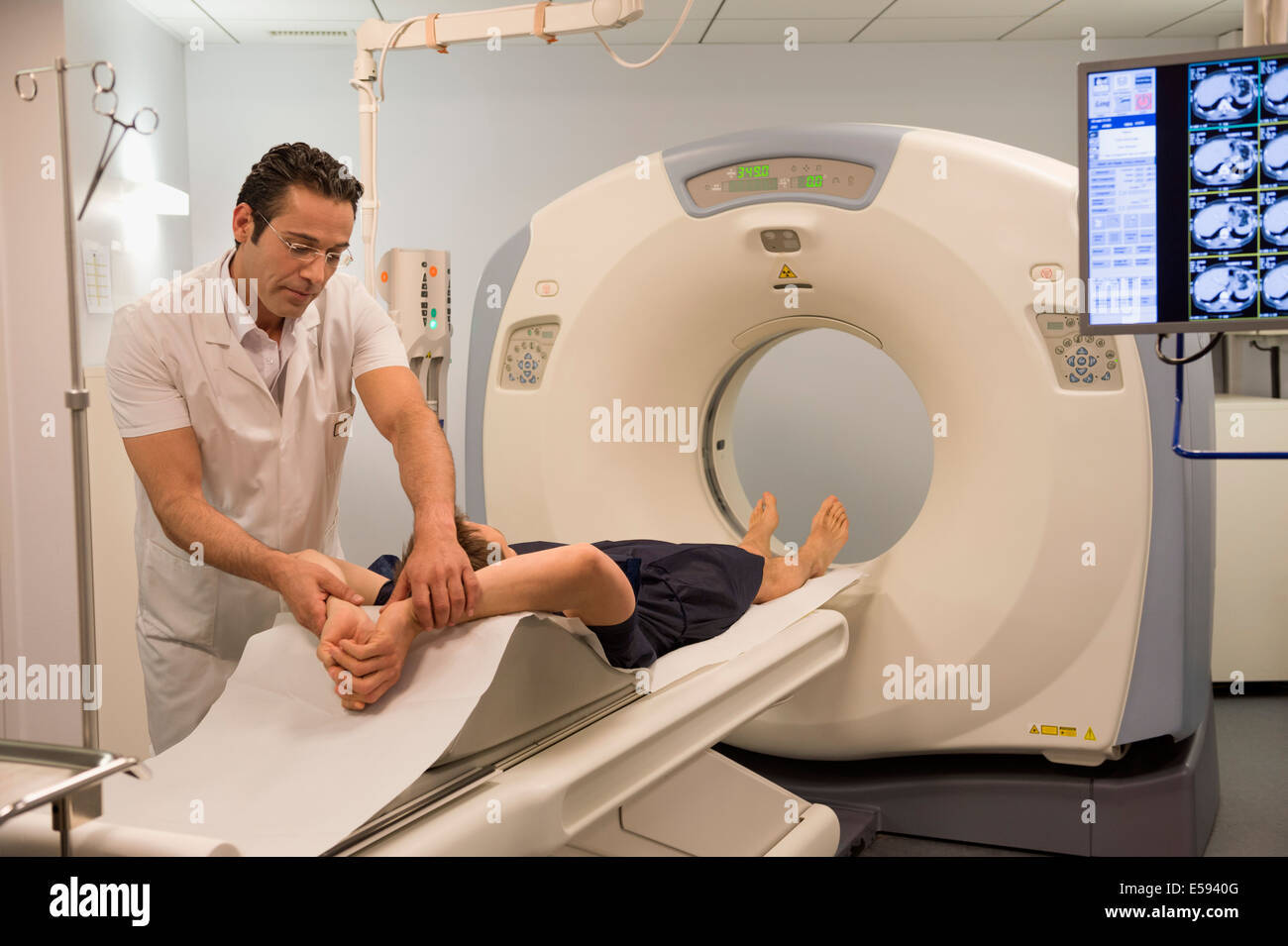 Male doctor preparing patient for MRI scan in hospital Stock Photo - Alamy