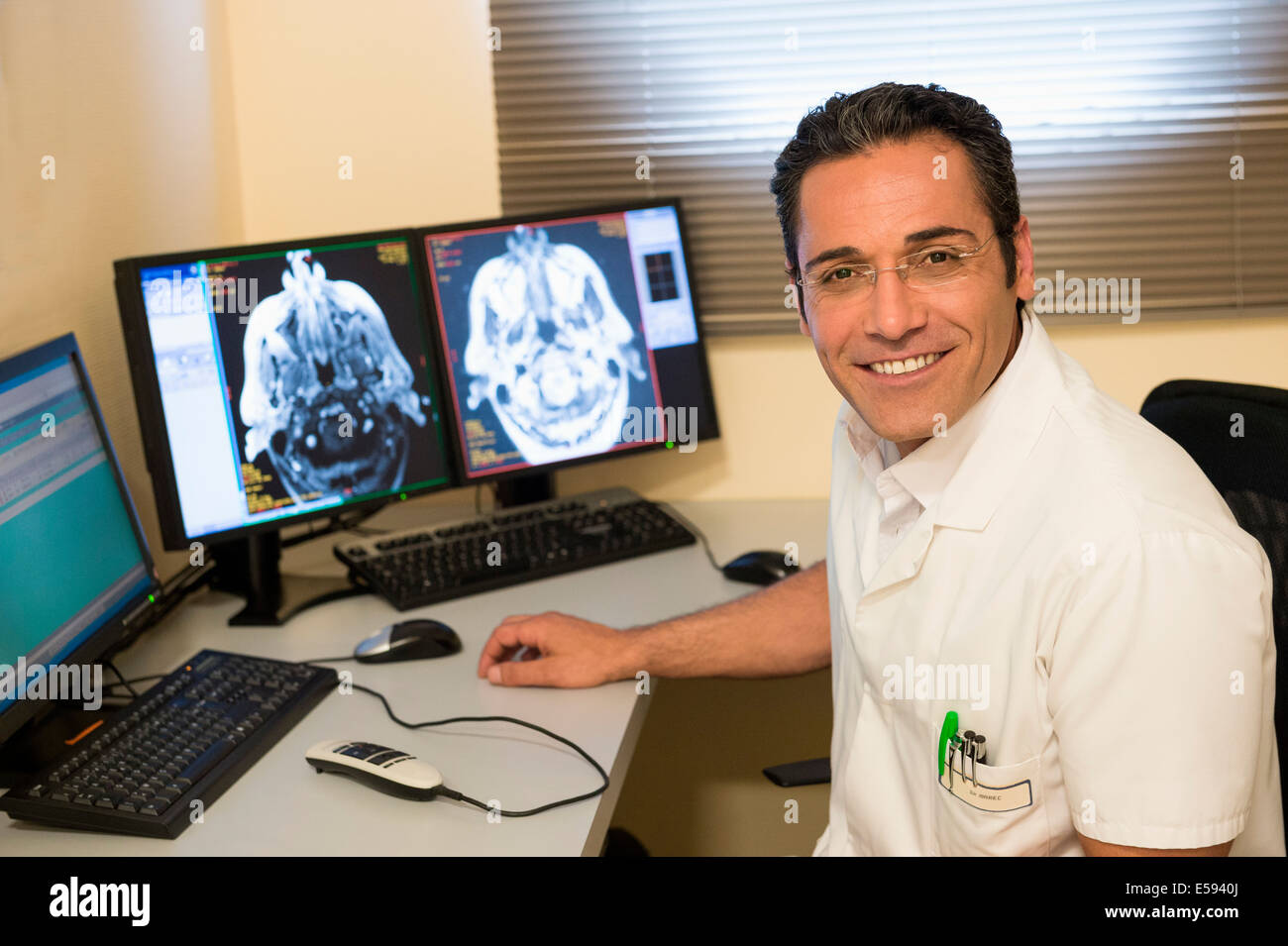 Male doctor examining brain MRI scan on computer Stock Photo - Alamy