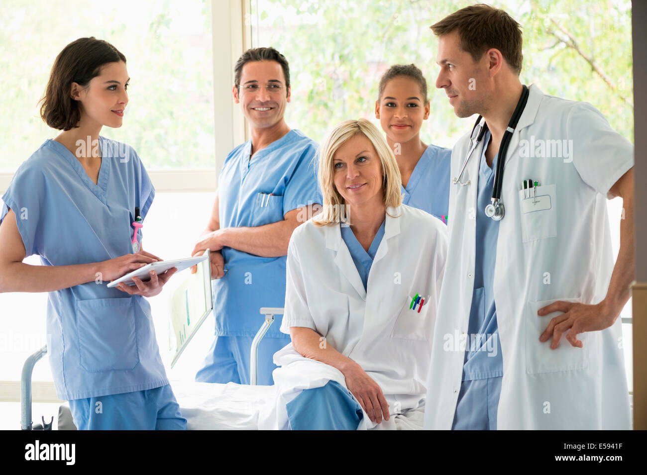 Medical team smiling Stock Photo - Alamy