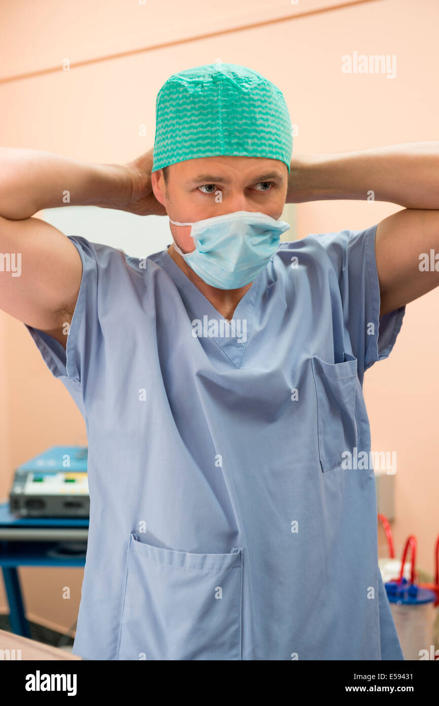 Mature male surgeon standing in hi-res stock photography and images - Alamy