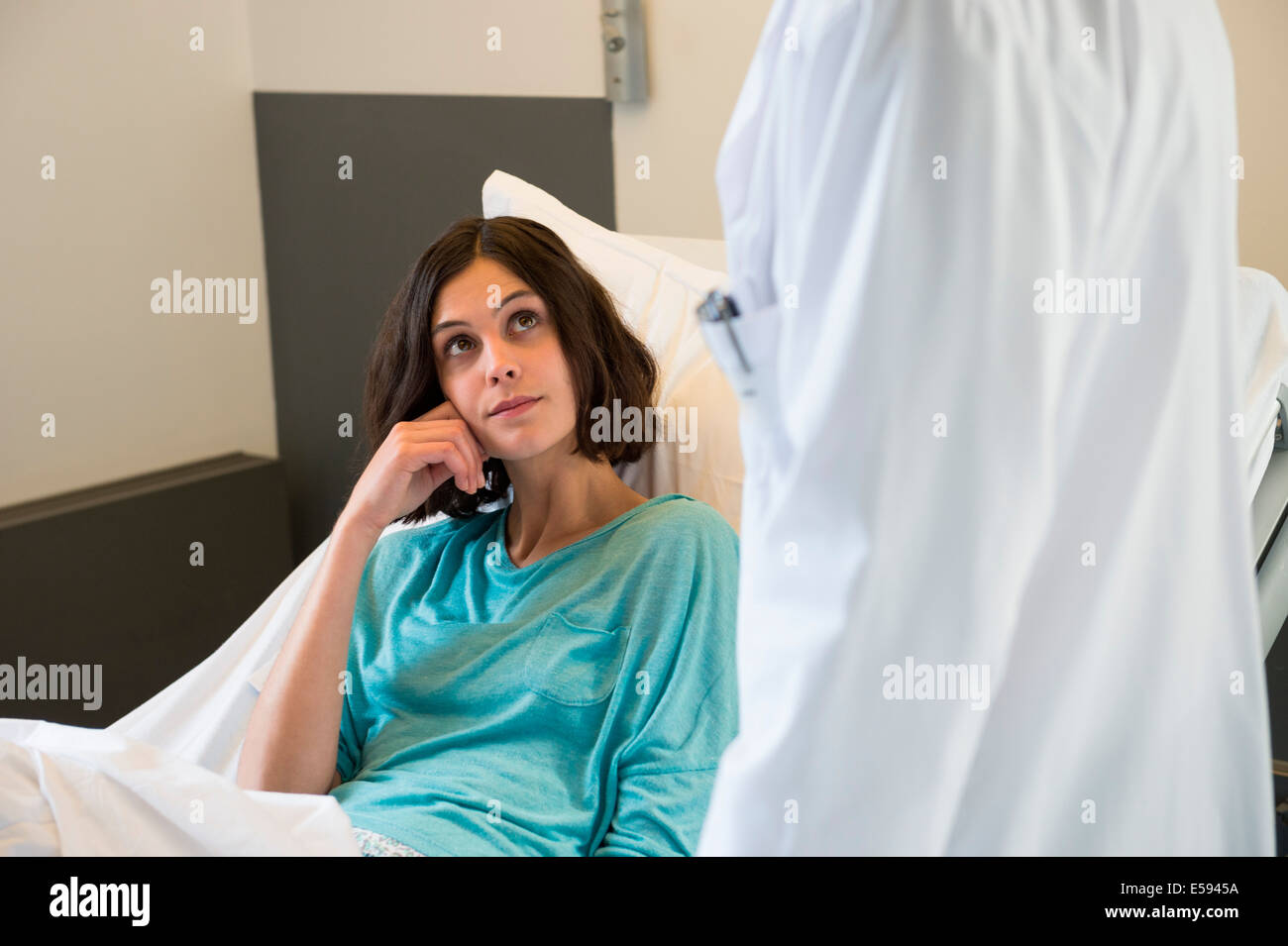 Male doctor attending a patient in a hospital Stock Photo - Alamy